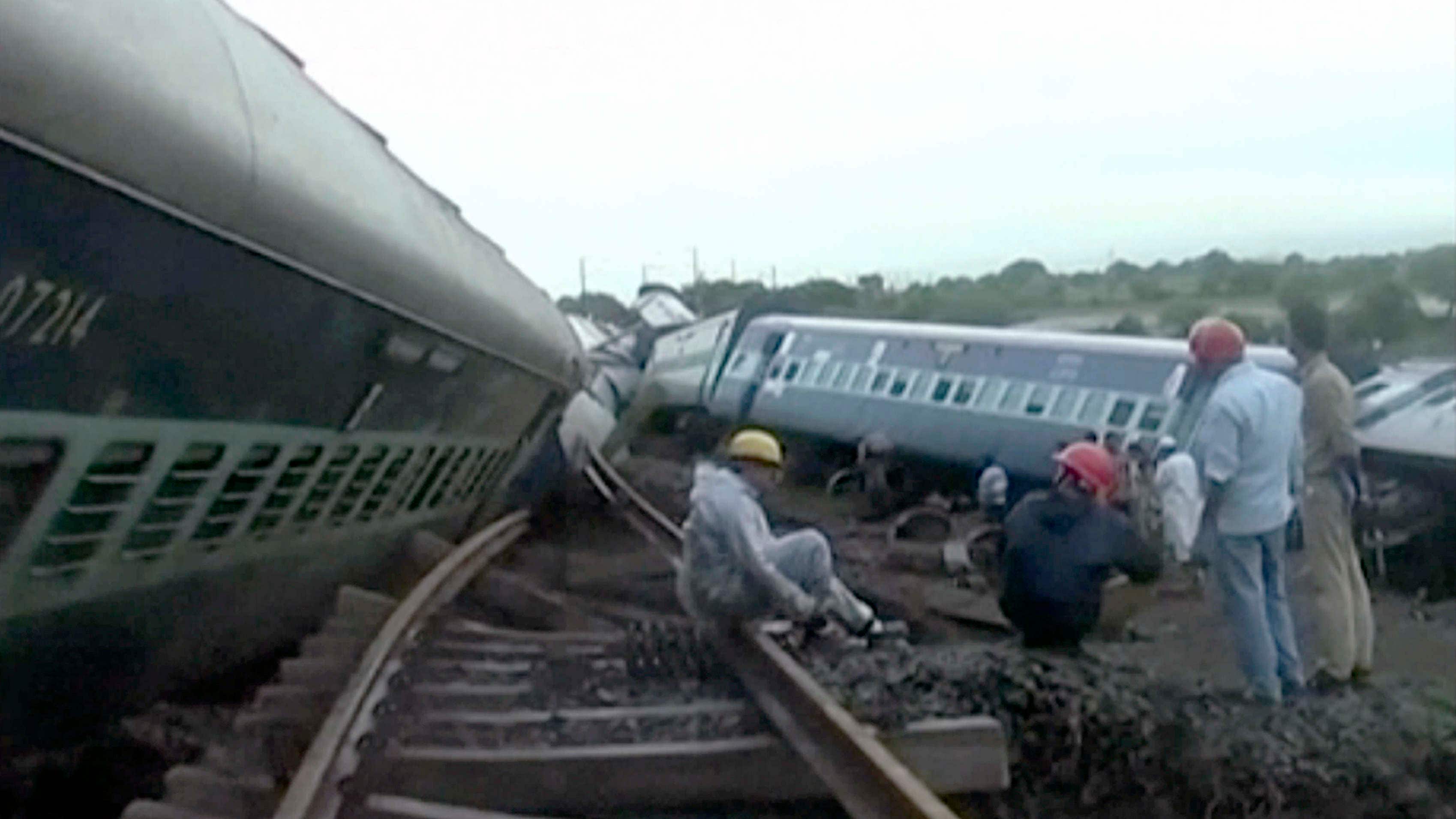 At least 24 dead, more than 300 rescued after twin train derailments in ...