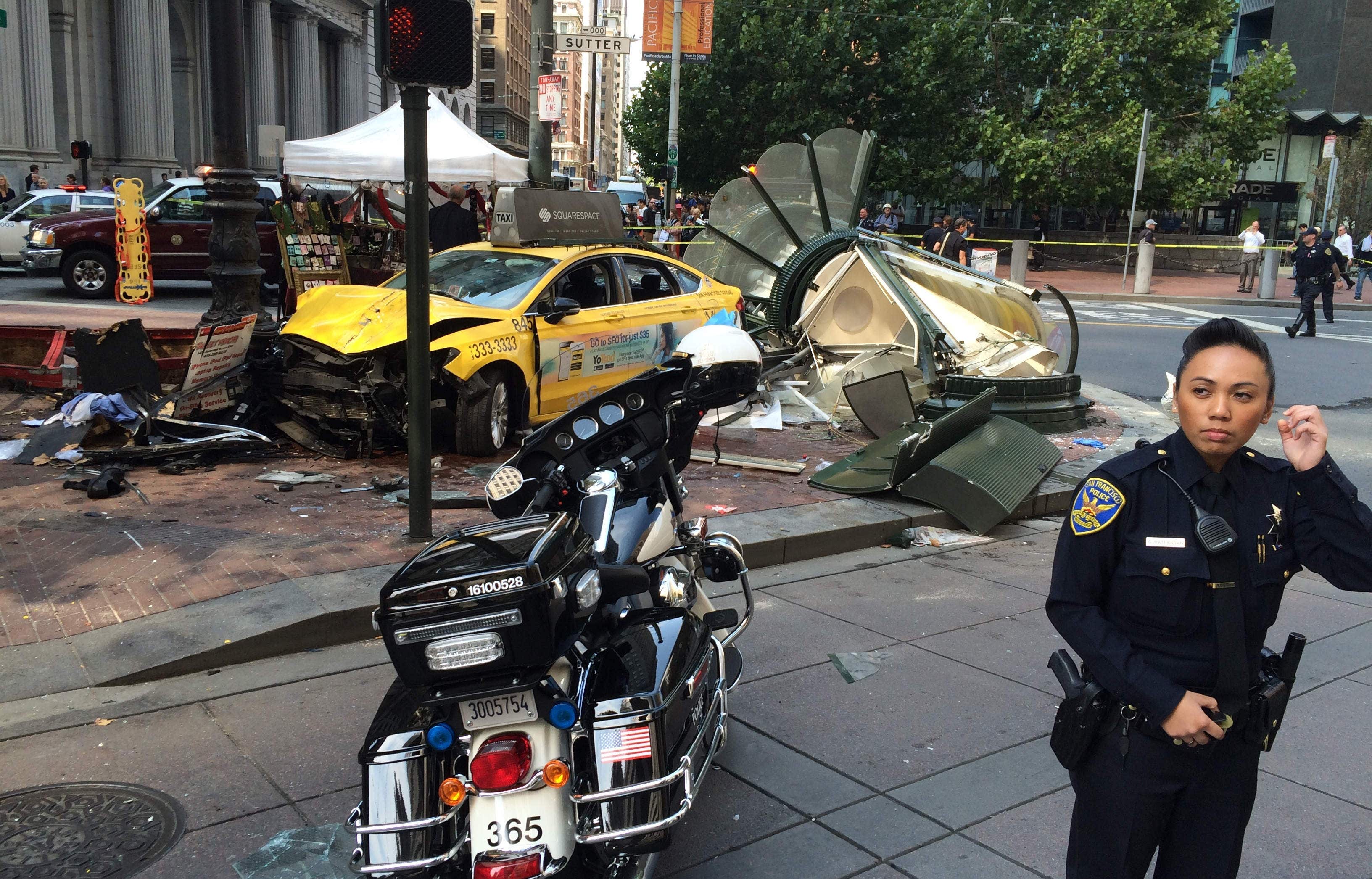 At least 3 injured after taxi jumps curb, strikes San Francisco stand ...