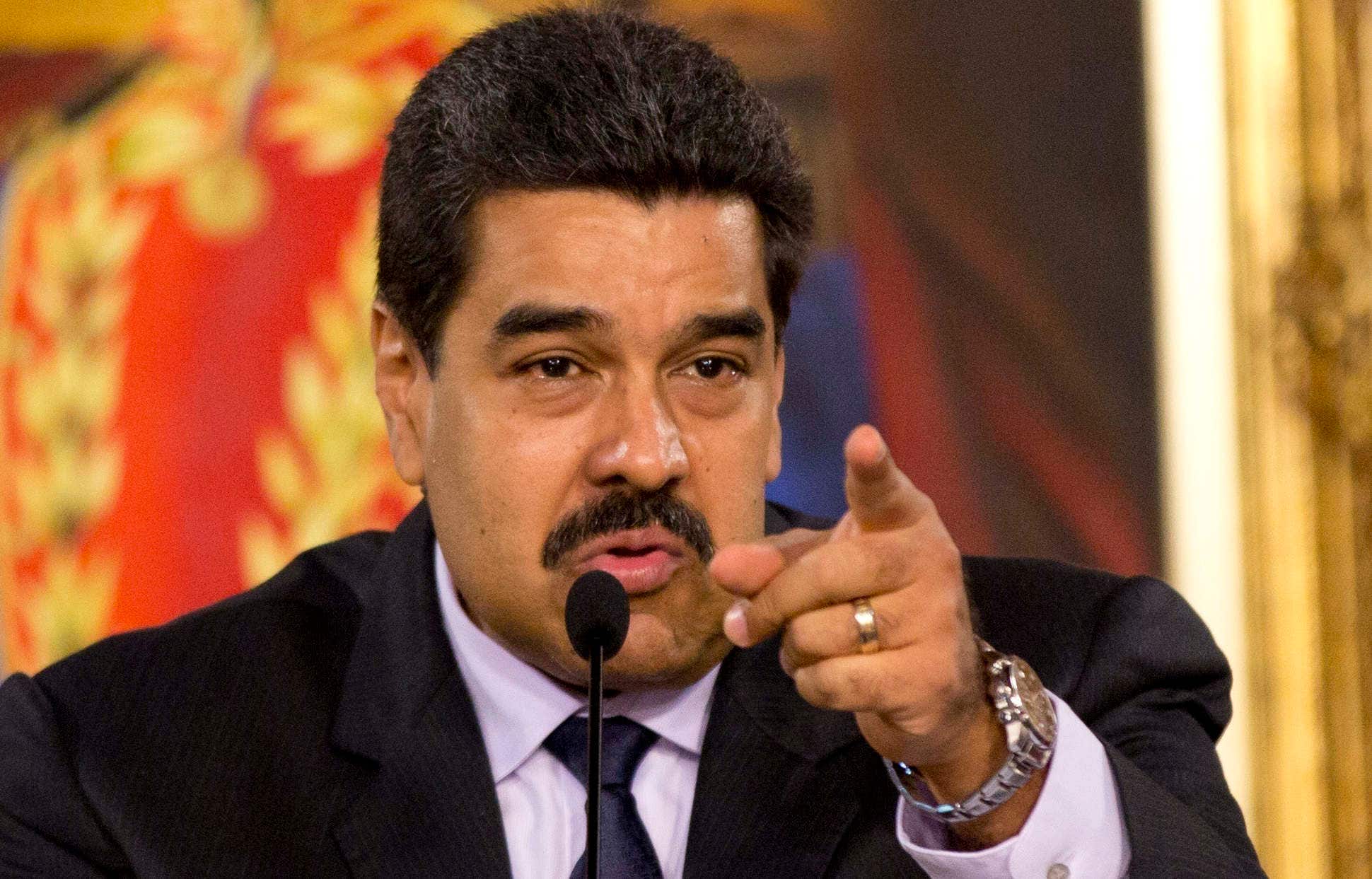 Venezuela leader Maduro met with insults by angry protesters during ...