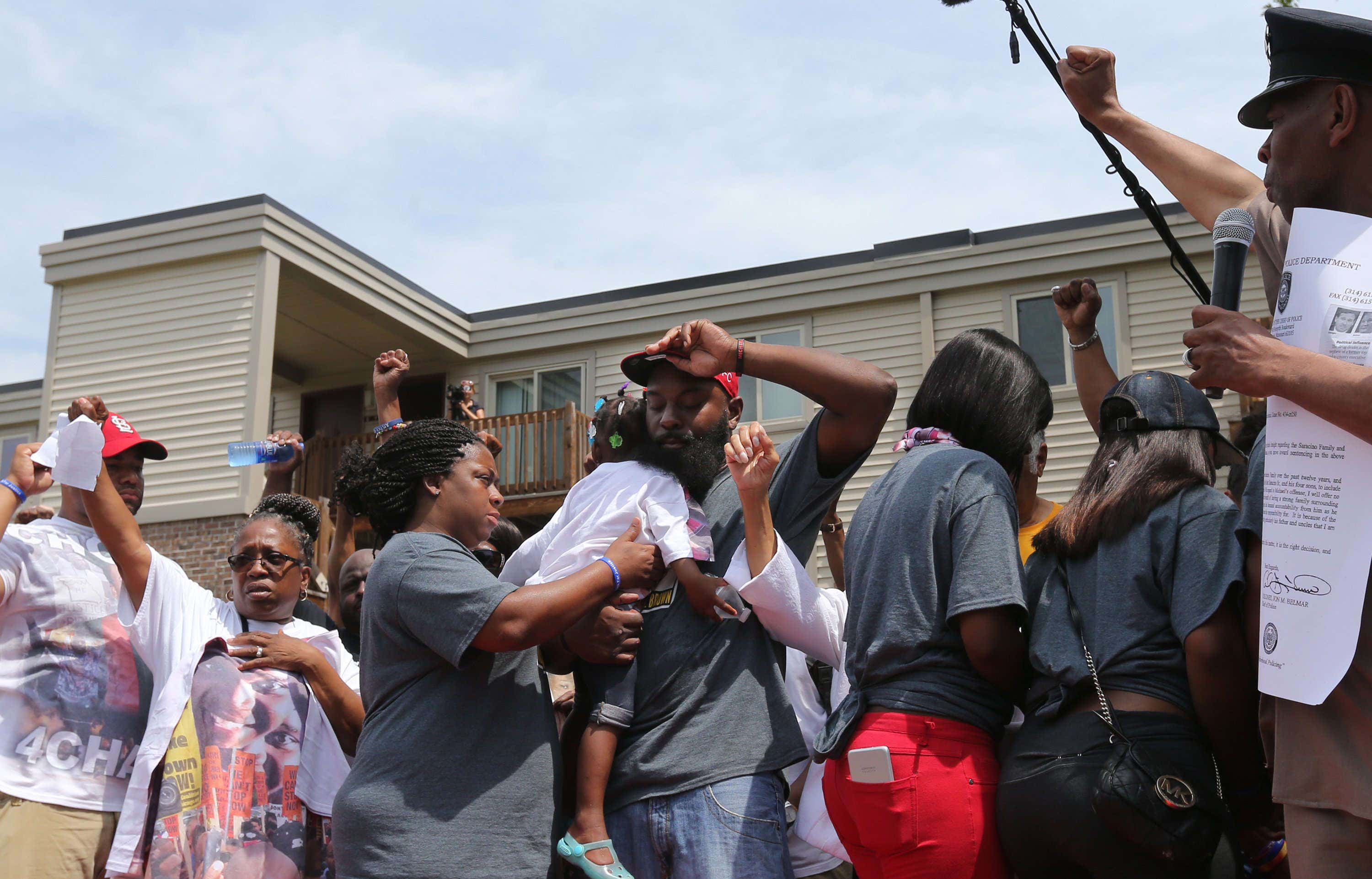 Gunfire breaks out after car runs over protester during Michael Brown ...
