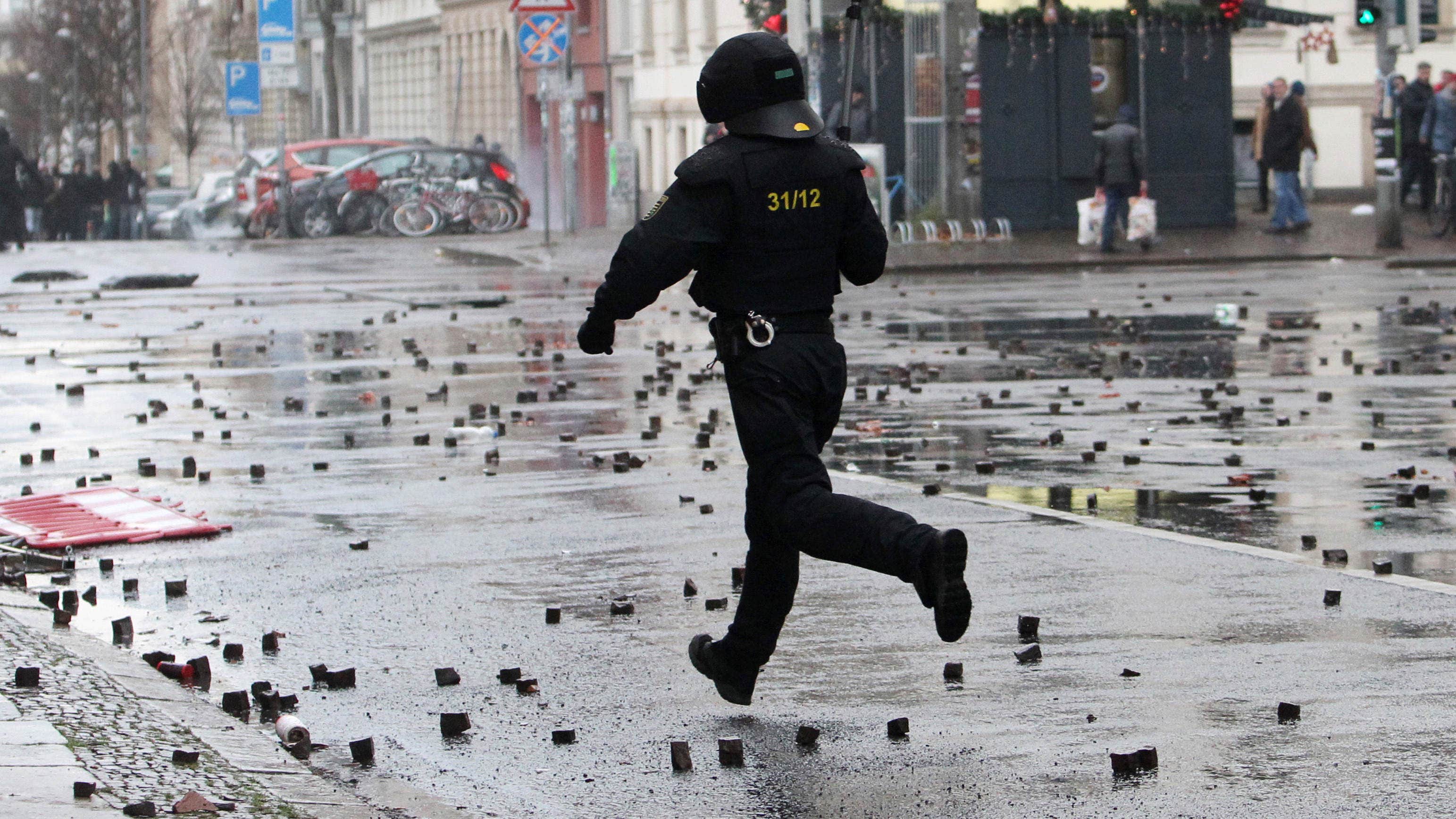 69 German police officers injured in clash with left-wing protesters ...