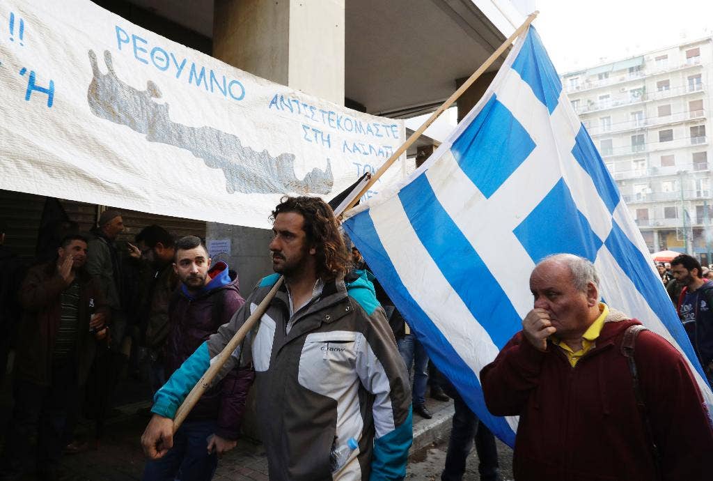 Greek farmers protesting tax hikes fight police in Athens | Fox News