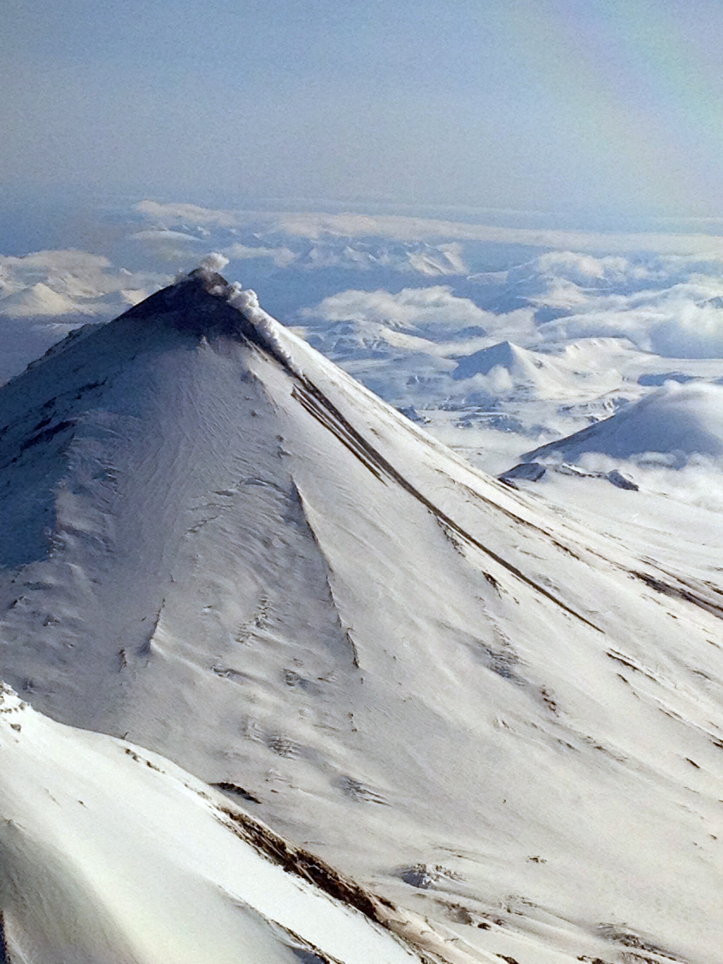 Remote Alaska volcano continues to erupt, with lava fountains, ash ...