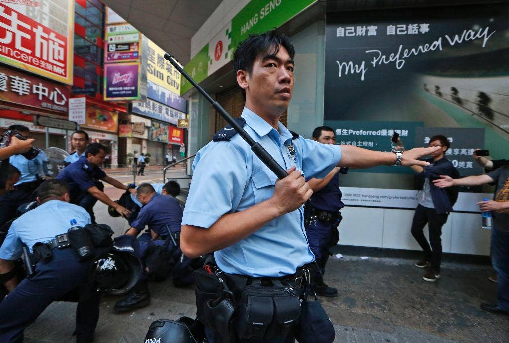 Hong Kong Police Use Pepper Spray Batons To Push Back Crowds Amid New