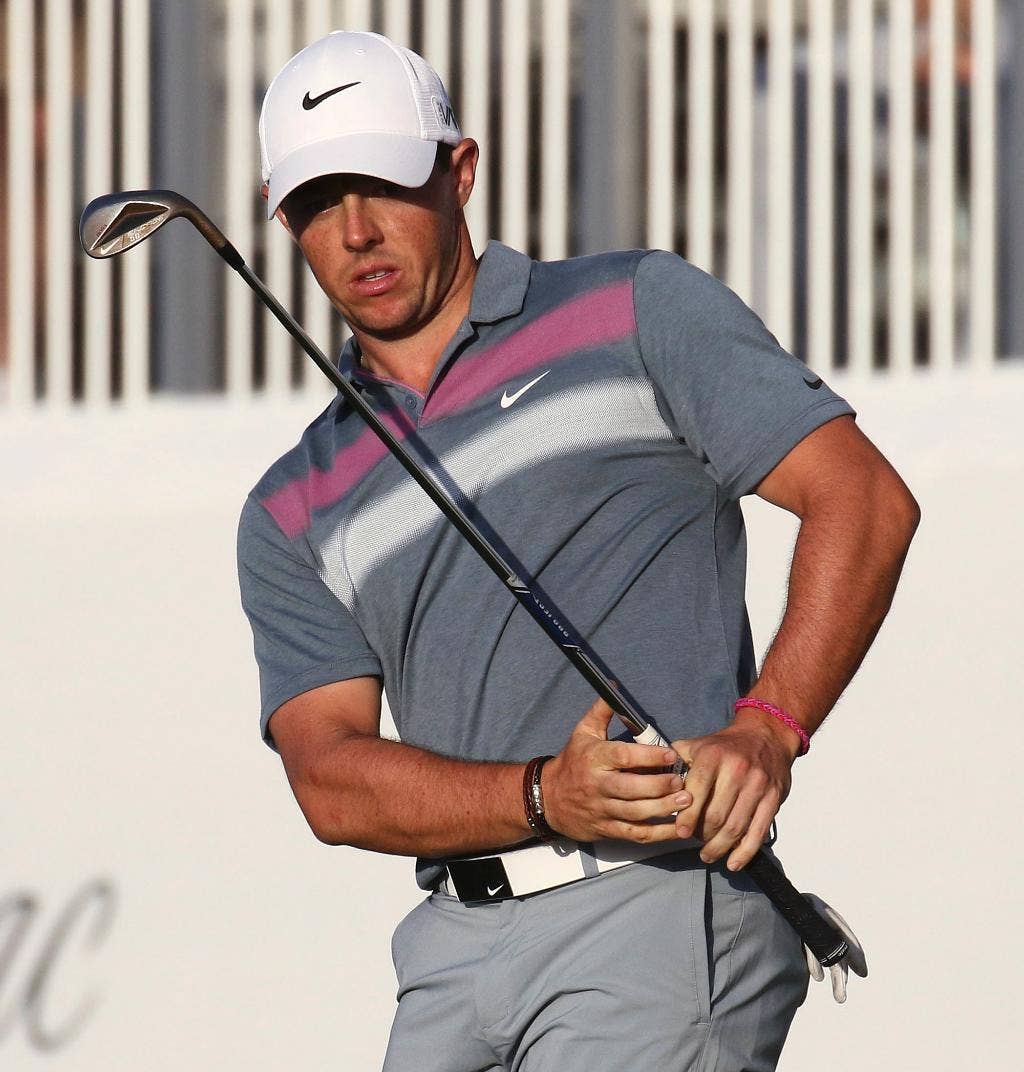 Rory McIlroy shows an angry side and heaves his club into the water at ...