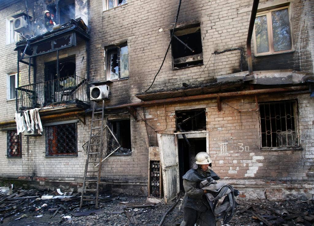 Building hit by rocket in eastern Ukraine, at least 1 dead, imperiling ...