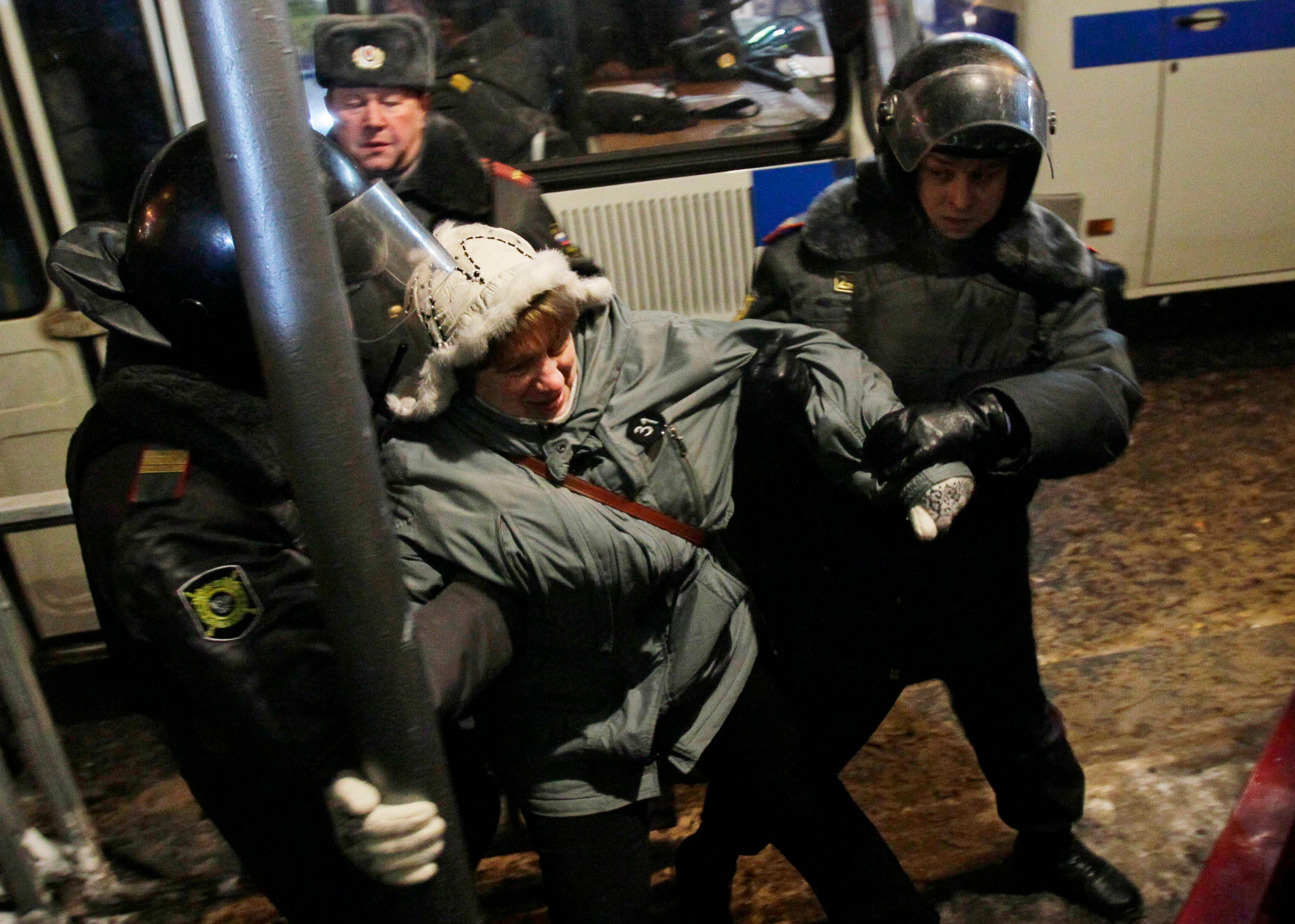 Moscow police arrest dozens to avert racist riots