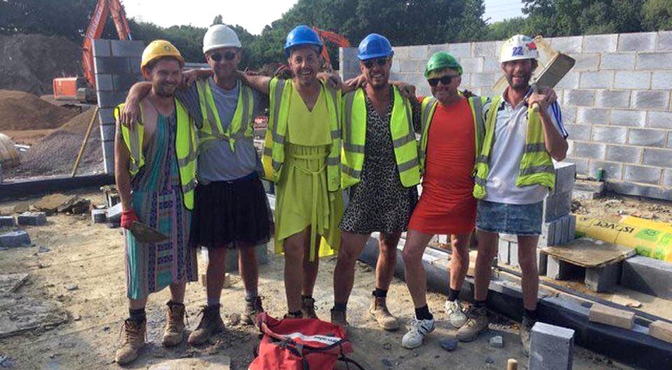 Bricklayers protest 'no shorts' dress code by wearing dresses | Fox News