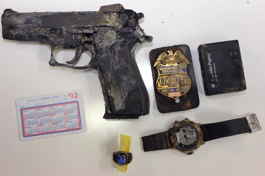 Agent's gun, badge lost 22 years ago found by fisherman in drought ...