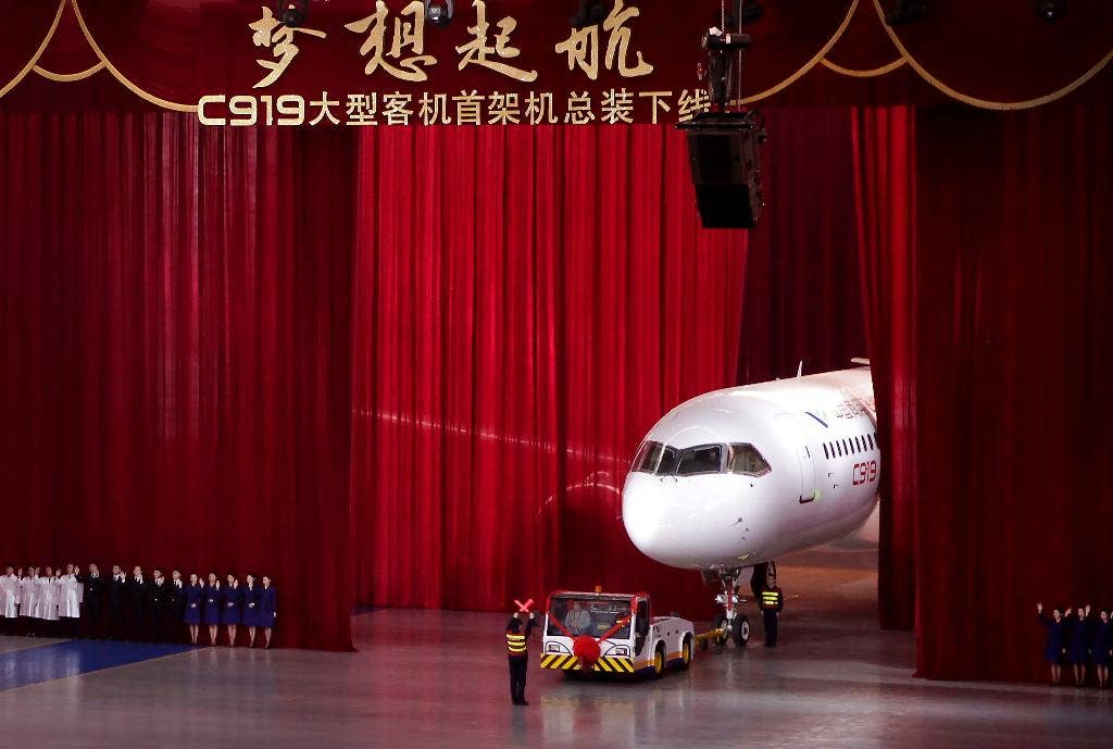 China unveils first large passenger jetliner in bid to compete with ...