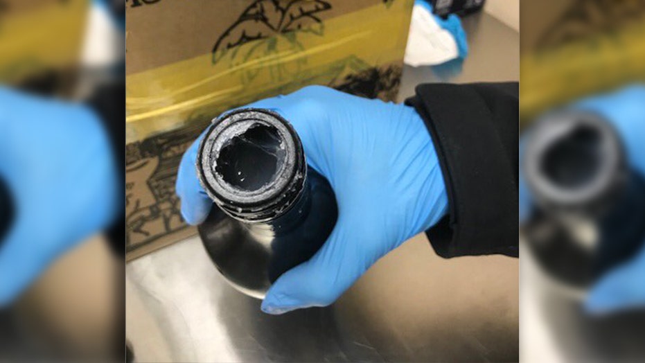 Expensive stash of cocaine spotted inside liquor bottle at JFK Airport ...
