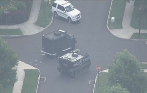 Off-duty cop surrenders after barricading self in home, firing at ...