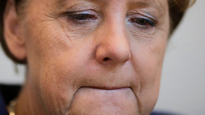 Awkward moment for Merkel as German chancellor's asylum comments bring ...