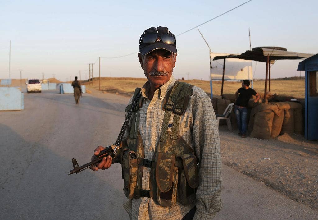 Kurdish fighters create safe passage for Iraqi Yazidis stranded for ...