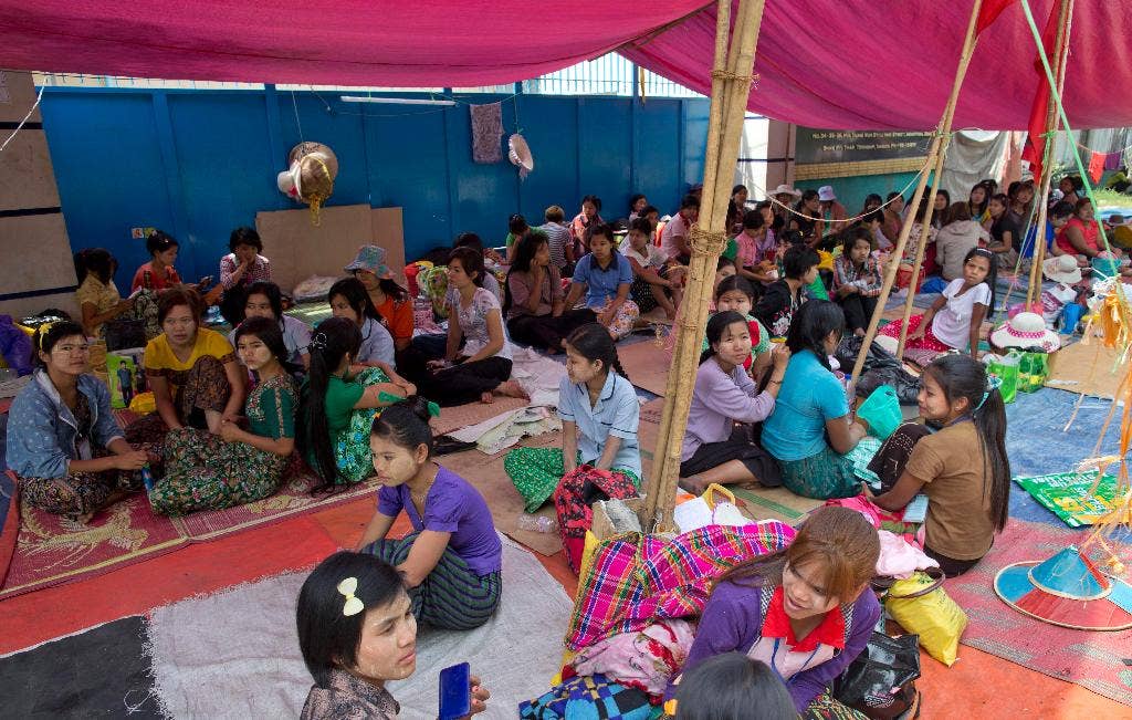 Myanmar police drag away factory workers after protest over working ...