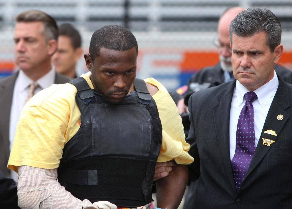 Prosecutor tells of shooting deaths of officer and carjacking victim as ...