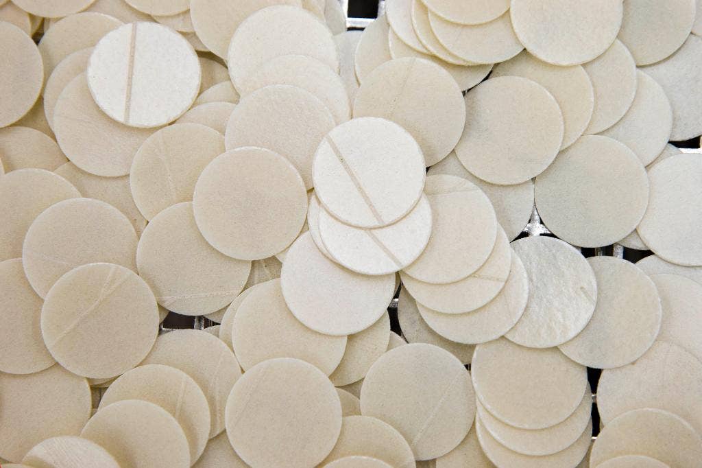Cloistered nuns work overtime to bake altar breads, or communion wafers ...