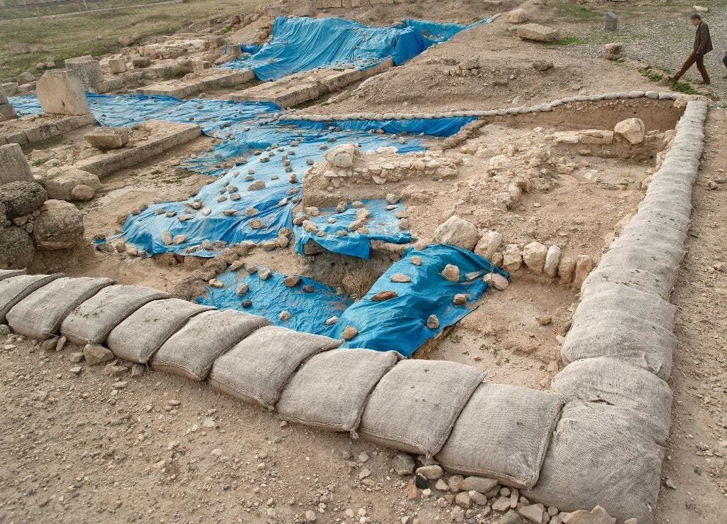 Archaeologists dig at site of ancient city near Islamic State ...