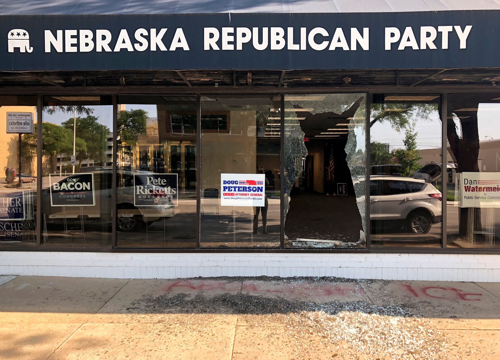 Nebraska GOP office windows smashed by bricks, 'Abolish ICE' spray ...