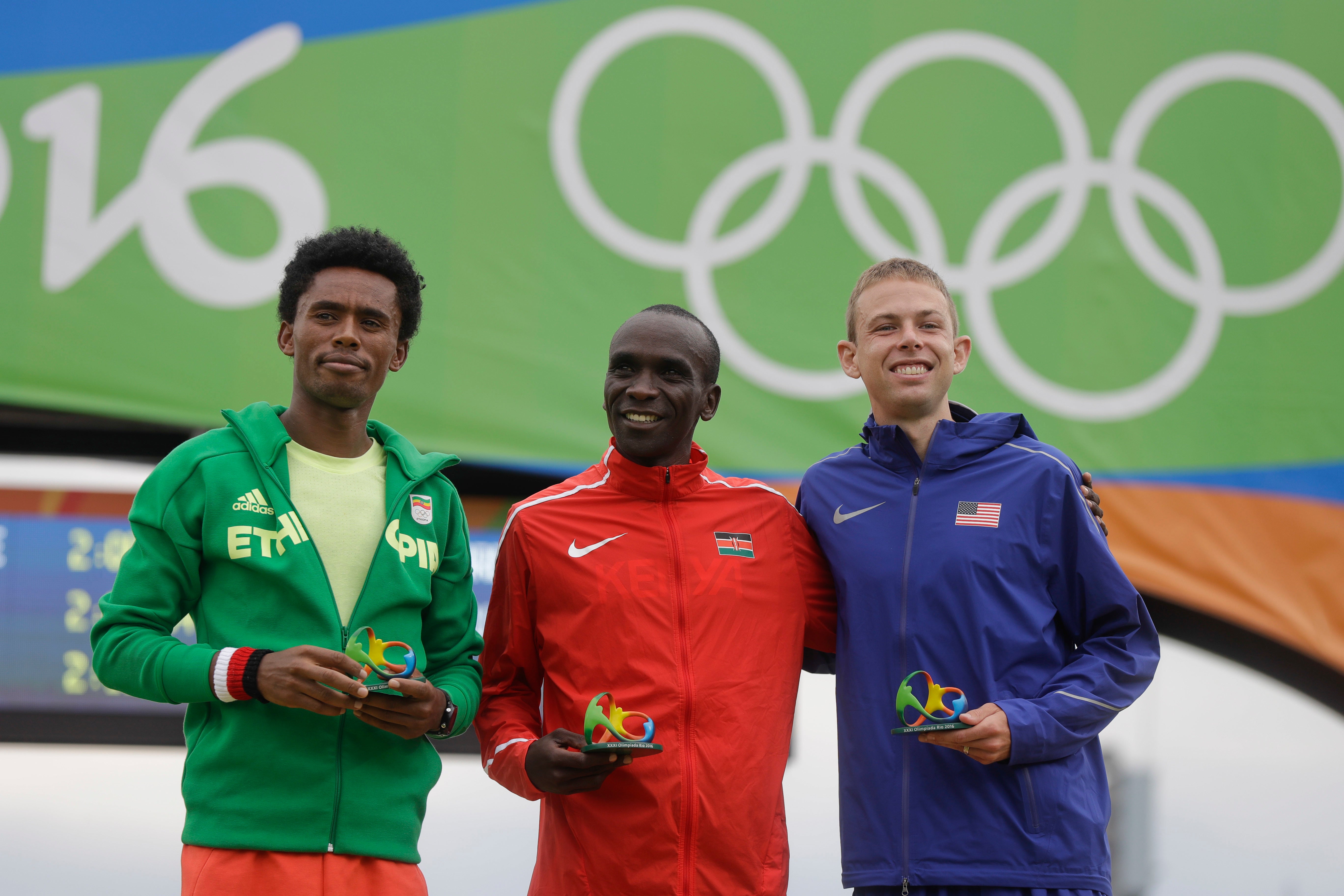 US runner takes bronze in marathon on final day of Olympic competition ...