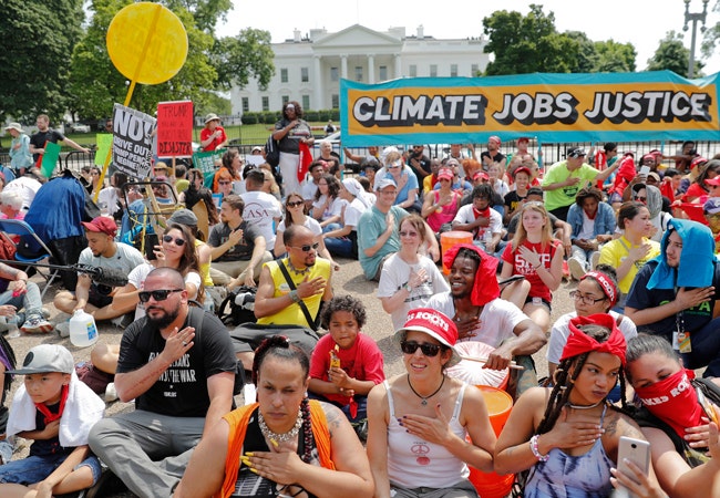 Climate March: Tens of thousands protest Trump climate policies, demand ...