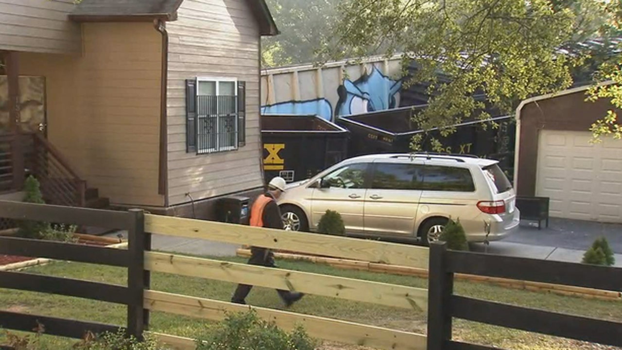 Train derails, crashes into Atlanta house and injures sleeping ...