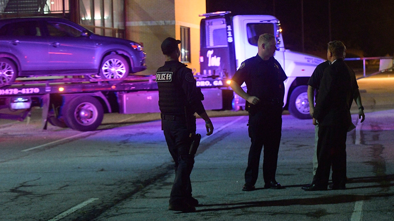 Two suspects held in fatal shooting at Georgia graduation ceremony ...