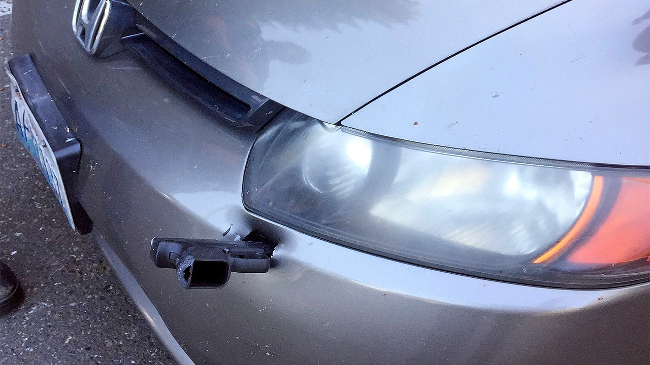 Gun 'flying through the air' lodges itself in car's bumper, authorities ...