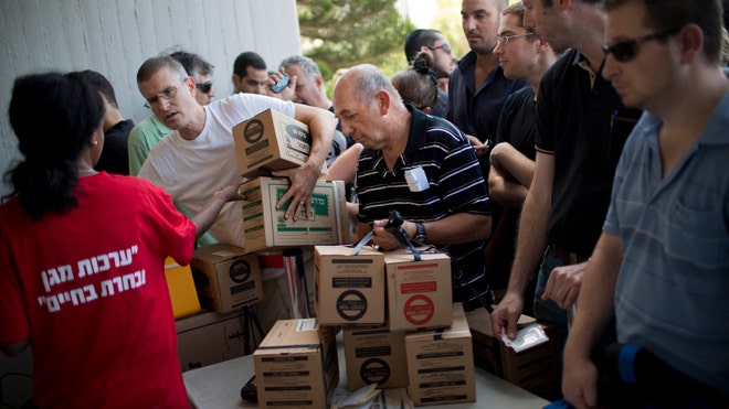 Israel calls up reserve troops over Syrian threat, hands out gas masks ...
