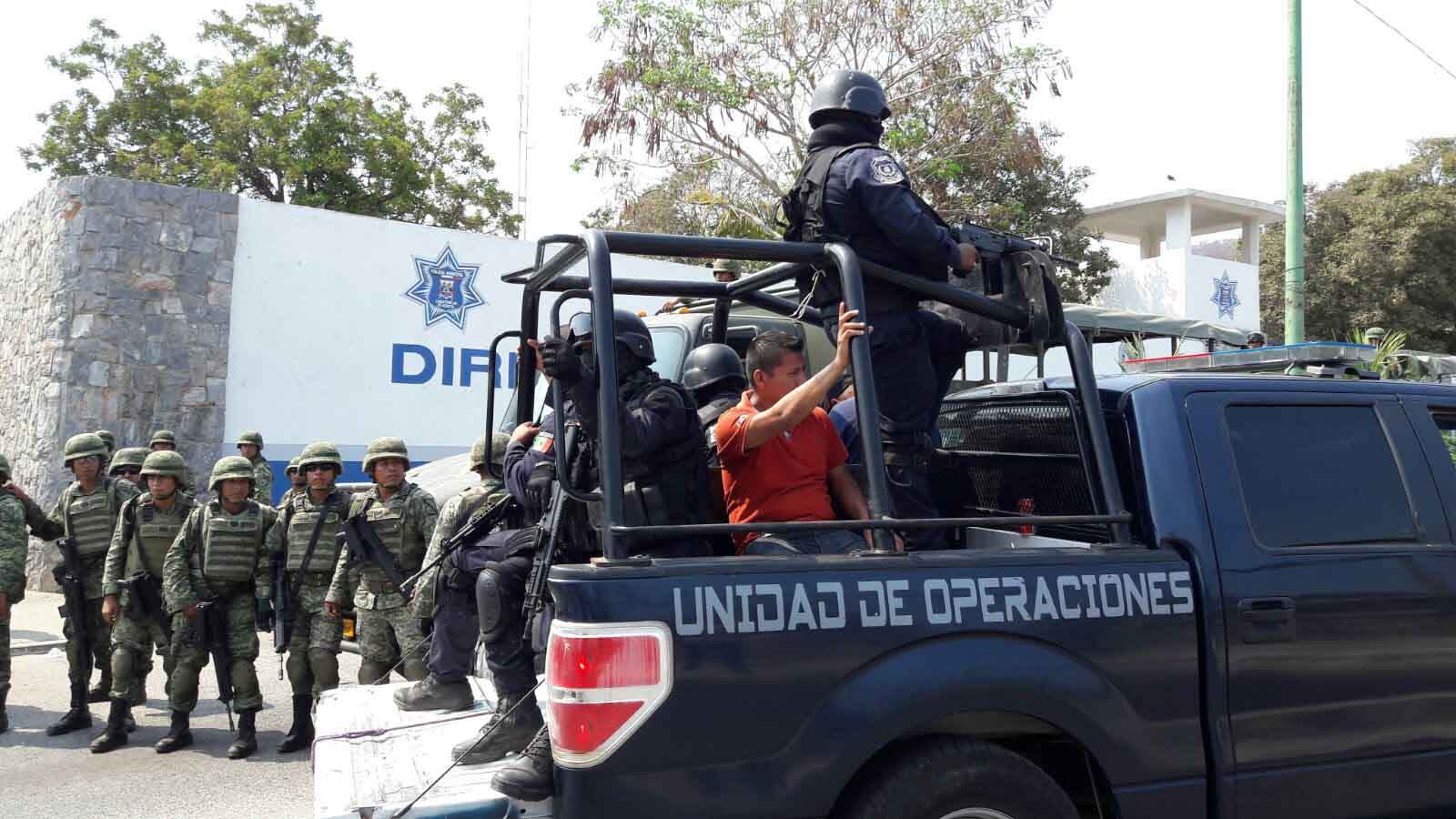 Mexican forces raid police precinct, find 20 officers had drug ...