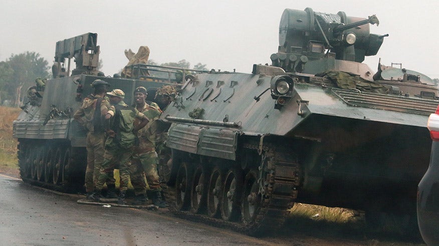Armored tanks near Zimbabwe capital amid tension between Mugabe ...