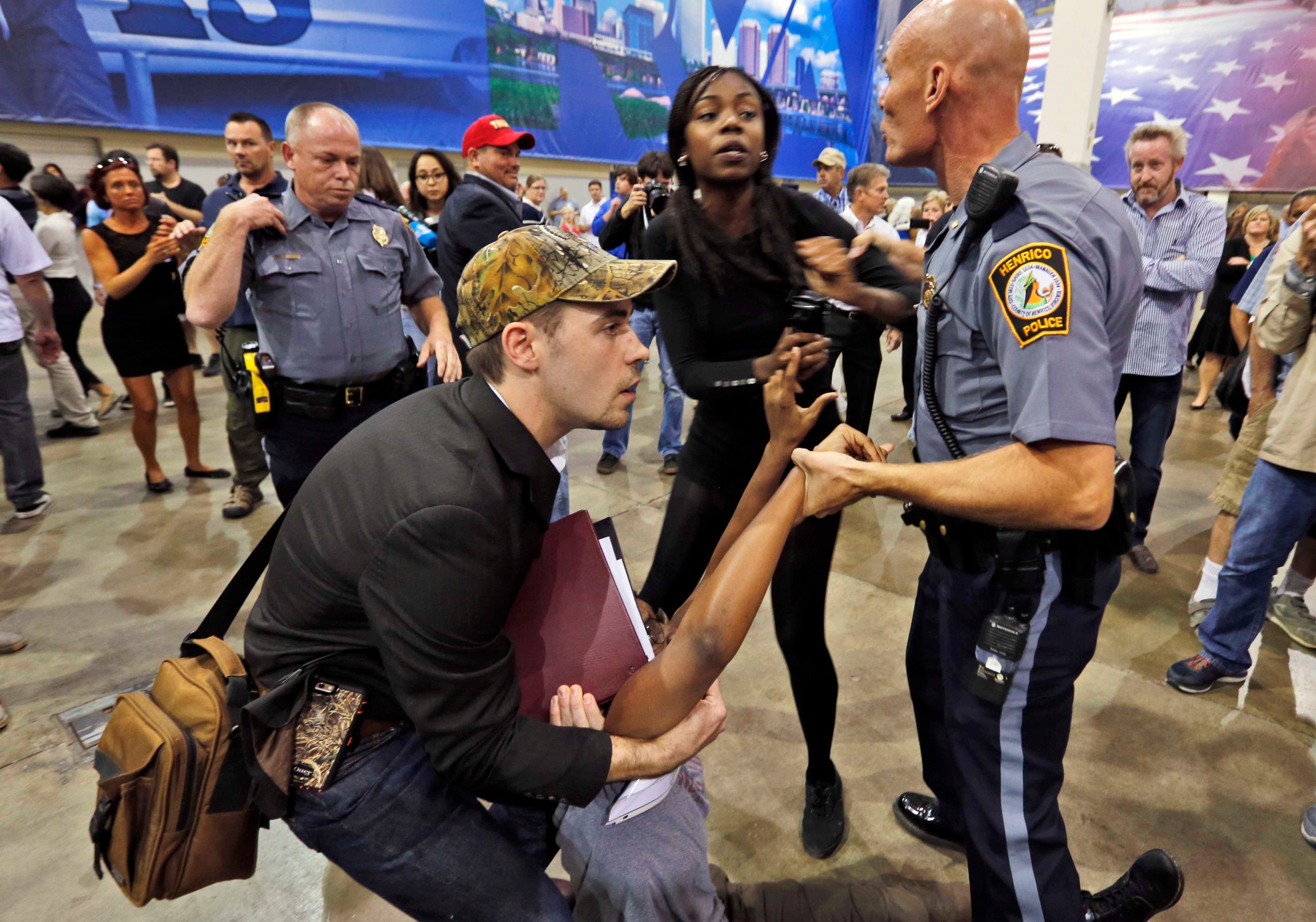 At Donald Trump event, supporters clash with, spit on pro-immigration ...