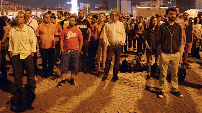 Turkish official approves 'standing man' protest, while police question ...