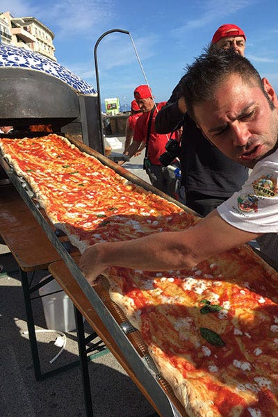 Italian chefs set new Guinness World Record with pizza over a mile long ...