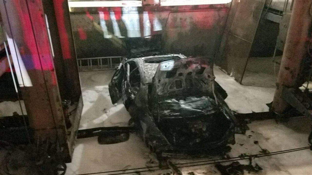 Car plummets down elevator shaft, bursts into flames at Miami parking ...