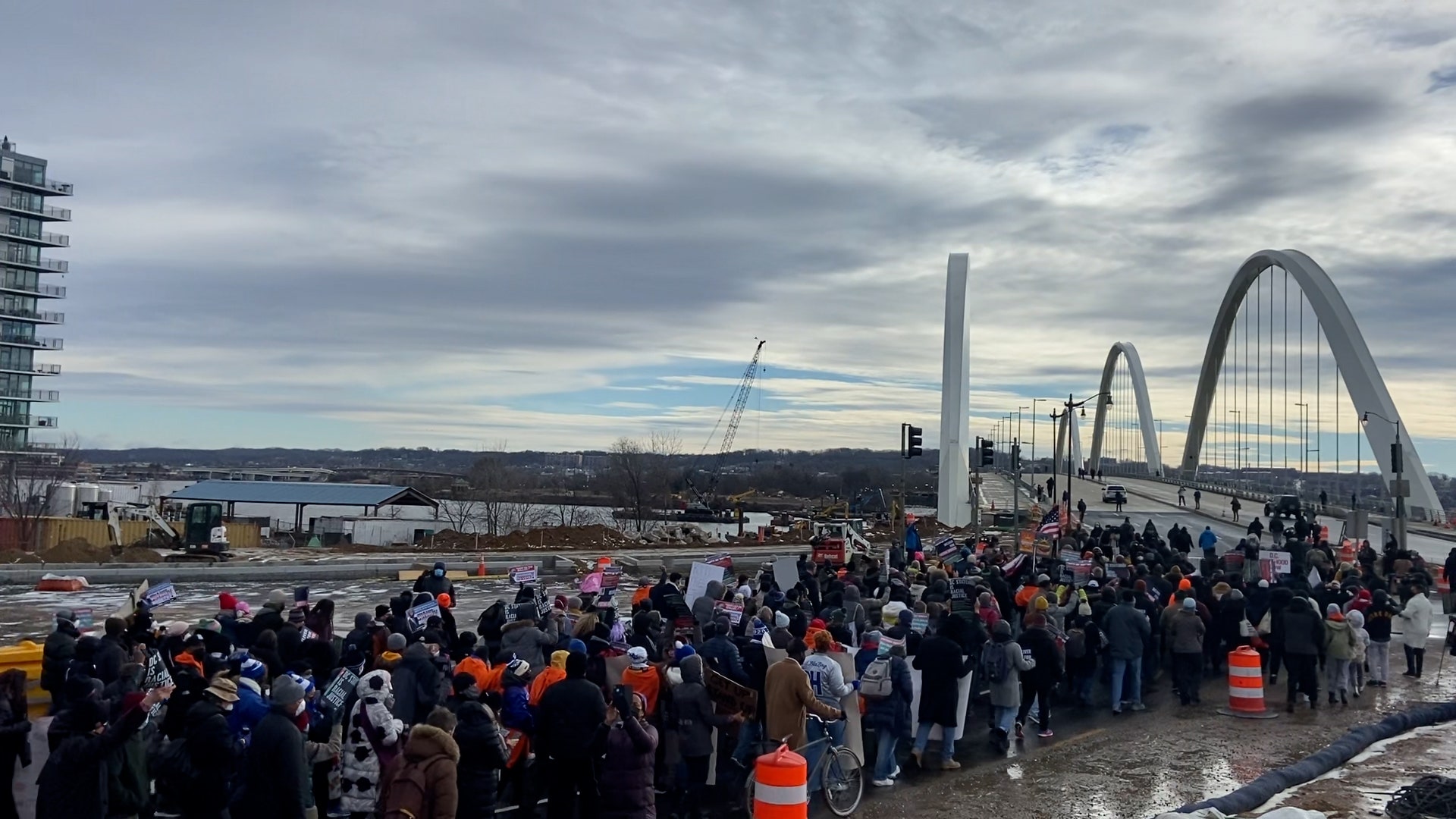 Hundreds mark MLK Day marching across Frederick Douglass Bridge, demand ...