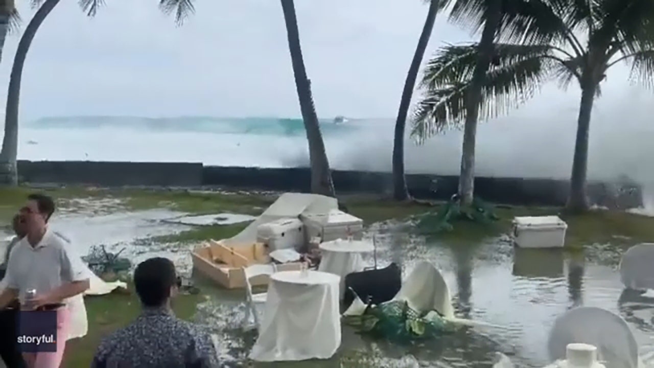 Wild video shows wave crash beachside Hawaii wedding | Fox News
