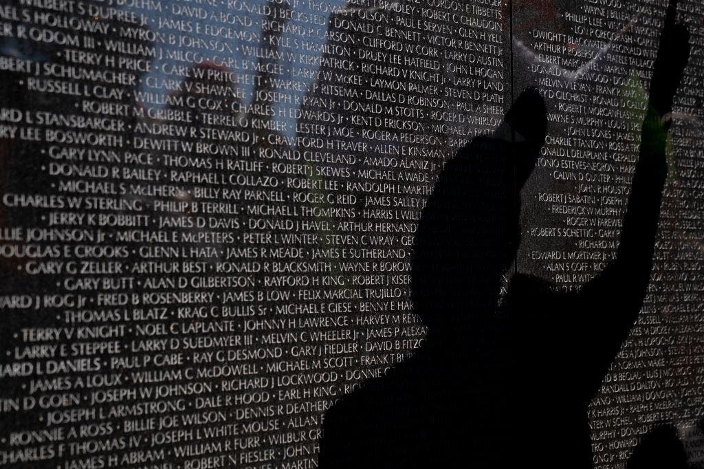 Volunteers located a photo of every service member whose name is listed ...